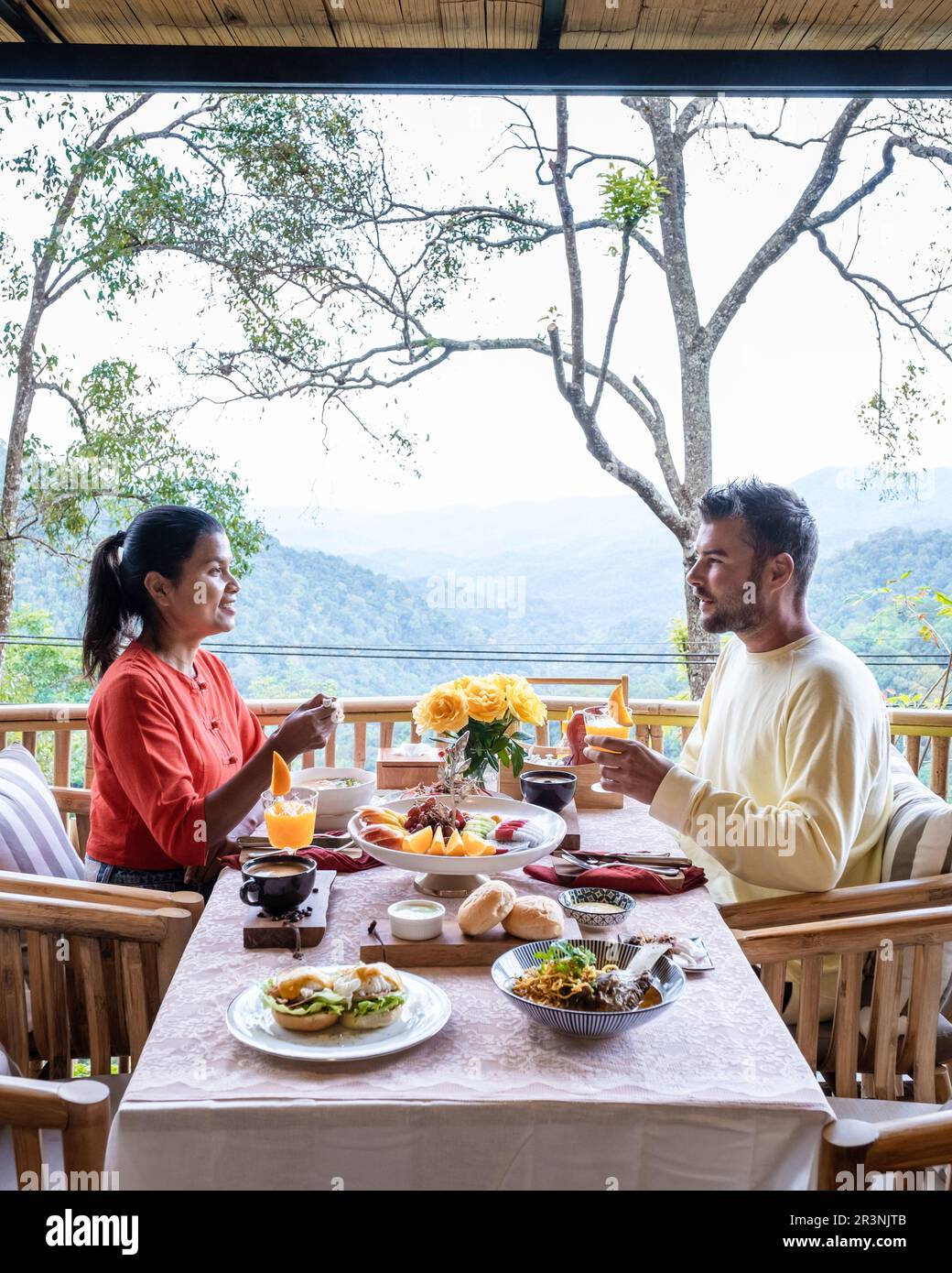 Luxury breakfast in the mountains of Chiang Mai Thailand, couple have ...