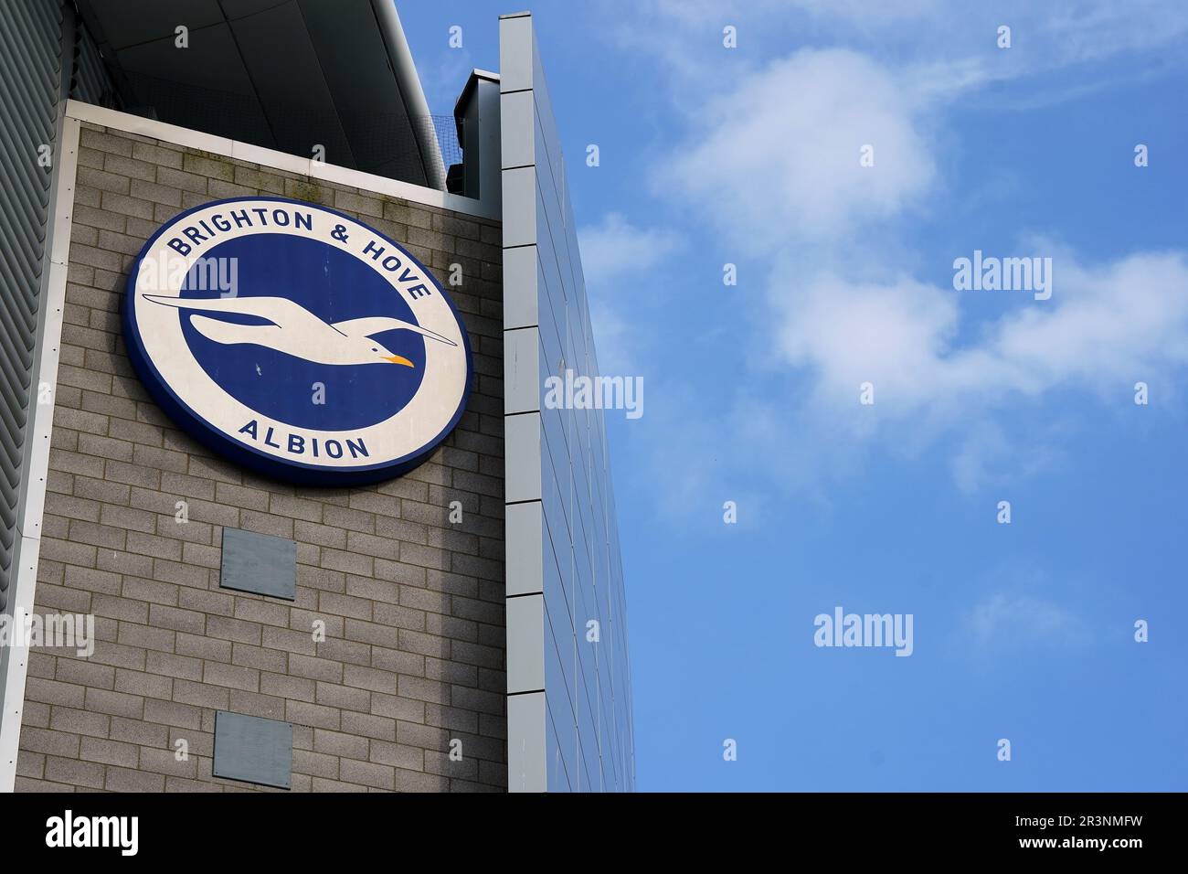 A Brighton and Hove Albion club crest on the outside of the ground ...