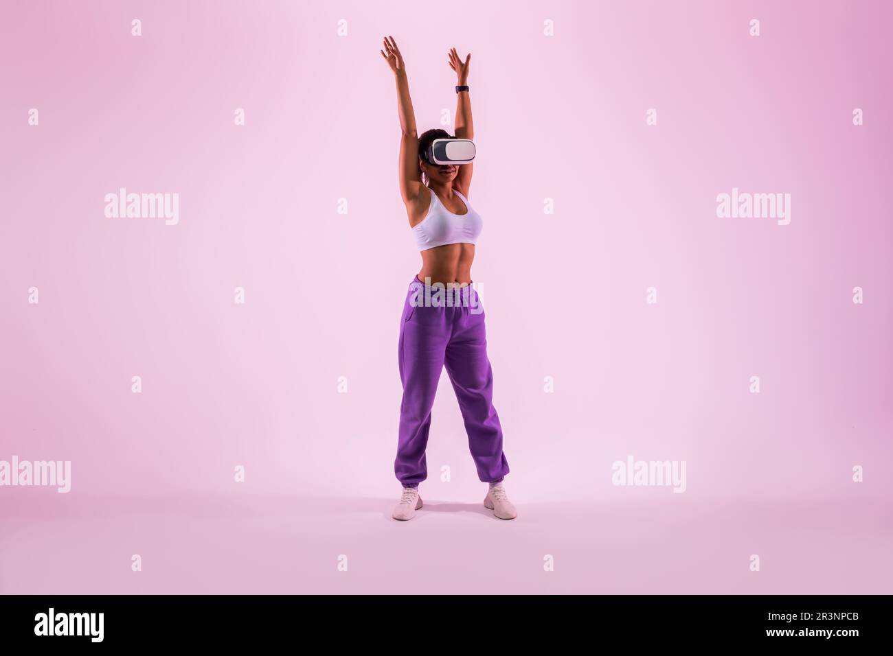 Exercising beyond reality. Fit black woman training in vr headset ...