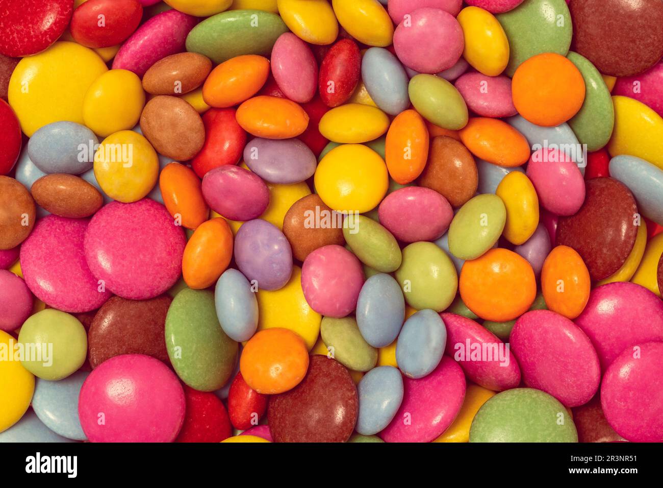 Two different sizes of colorful candies Stock Photo - Alamy