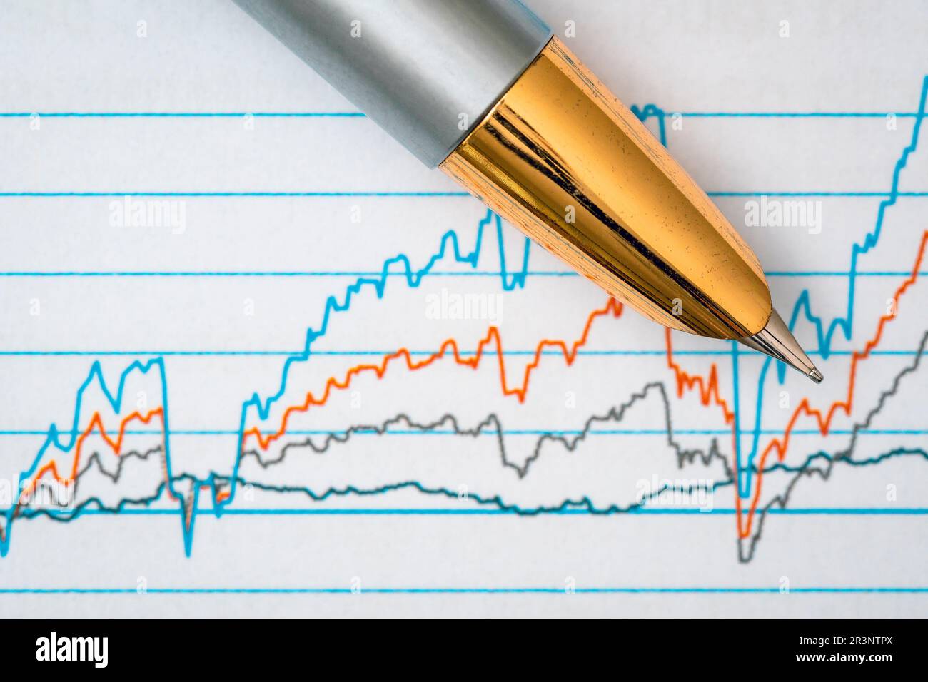 Pen showing diagram on financial report Stock Photo - Alamy