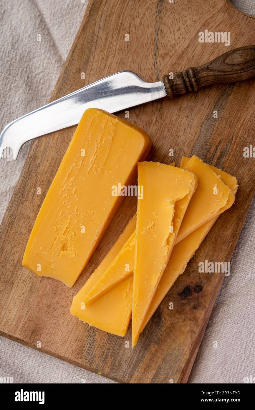 Cheese collection, piece of matured British yellow cheddar cheese made ...