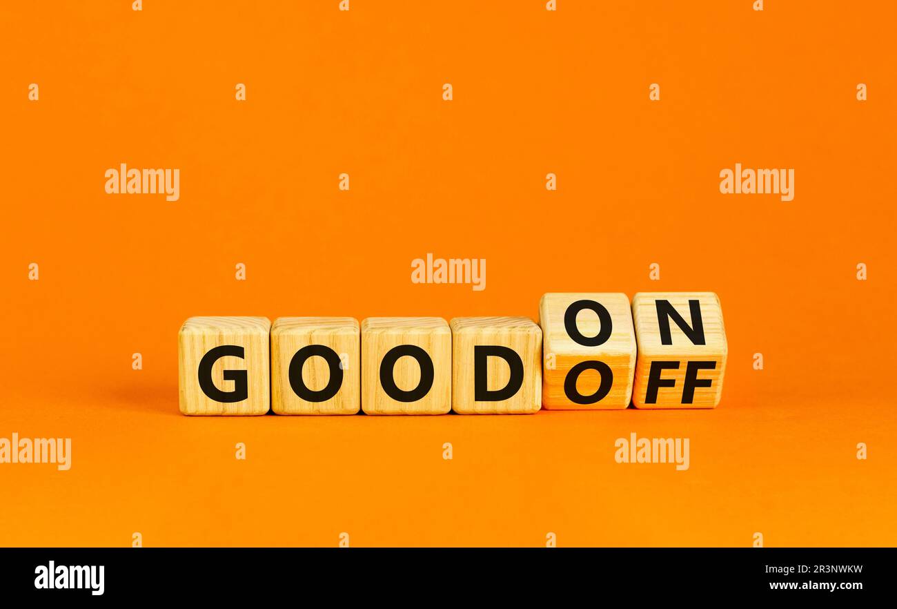 Good on or off symbol. Businessman turns wooden cubes and changes word ...