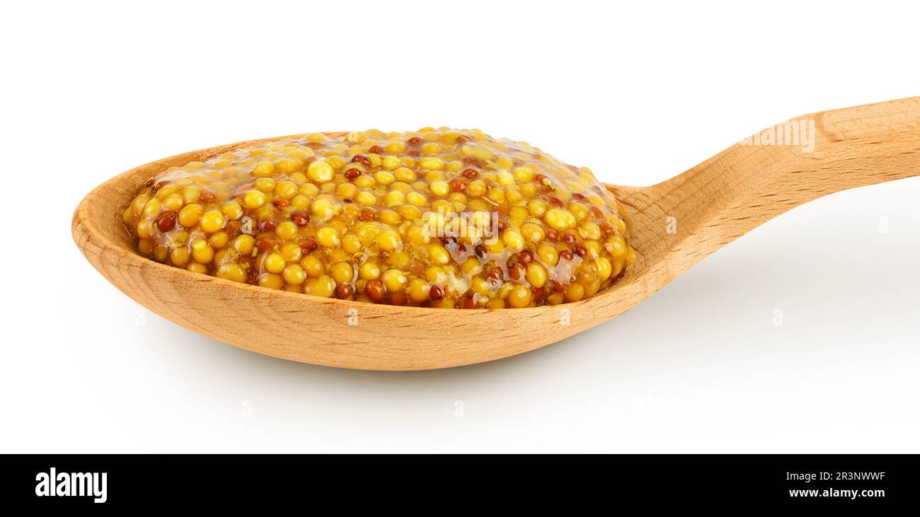 french mustard in wooden spoon isolated on white background with full ...