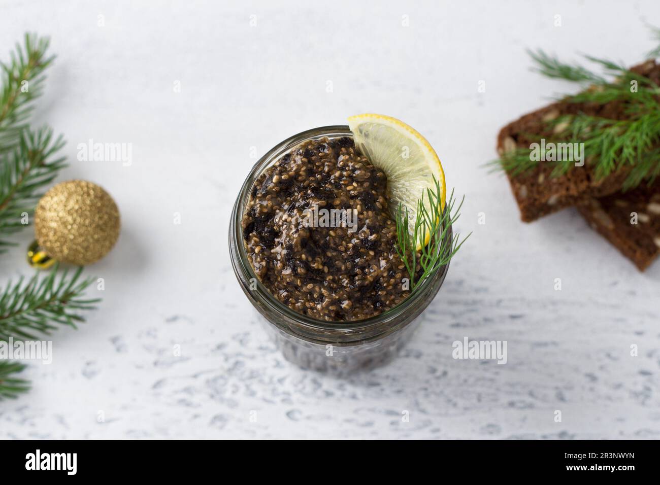 Vegan healthy chia caviar with nori and soy sauce in a jar, bread with ...