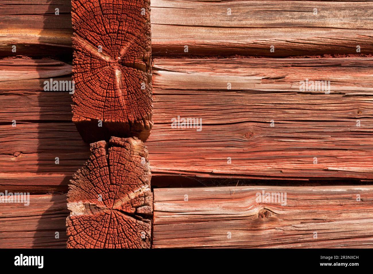 Closeup, macro of red painted logs, timber on the wall of a building ...