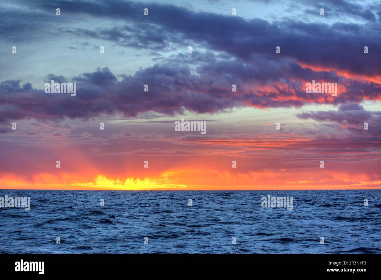 Scarlet sunset over the ocean in Drake's Passage Stock Photo - Alamy