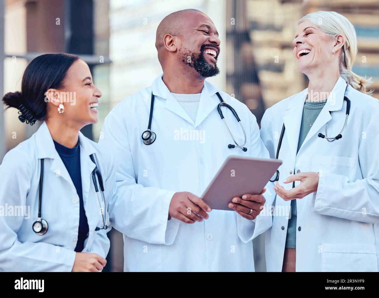 Doctor team, laughing and healthcare worker with tablet and funny joke ...