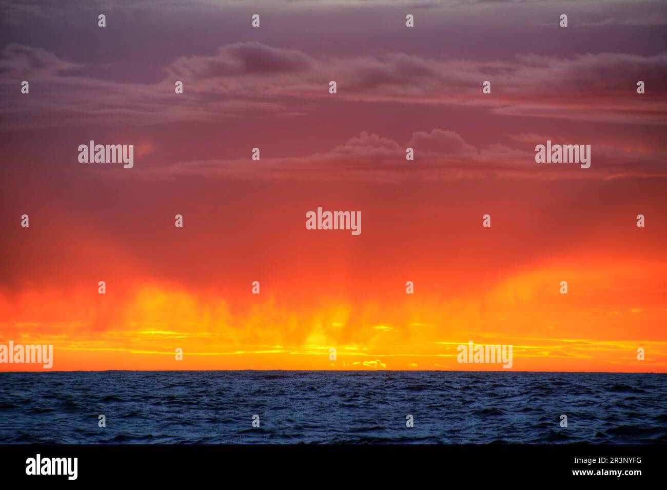 Scarlet sunset over the ocean in Drake's Passage Stock Photo - Alamy