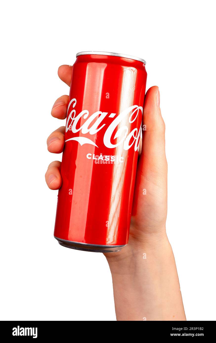 Berlin Germany May 23 2023 Hand holding Cola drink, packed in red metal ...
