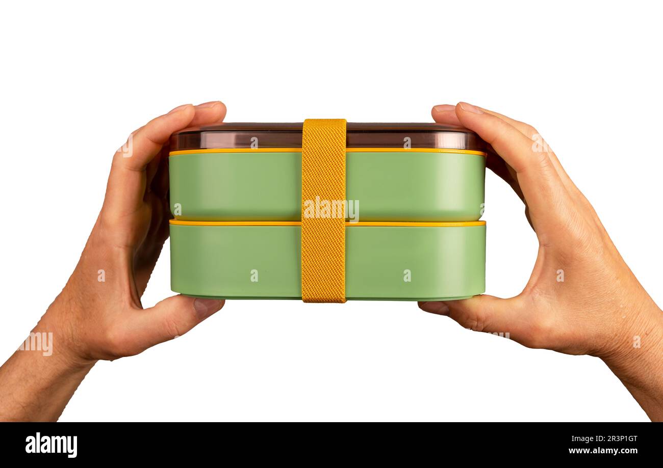 Male hands holding double lunch boxes with ribbon. Lunchbox isolated on ...