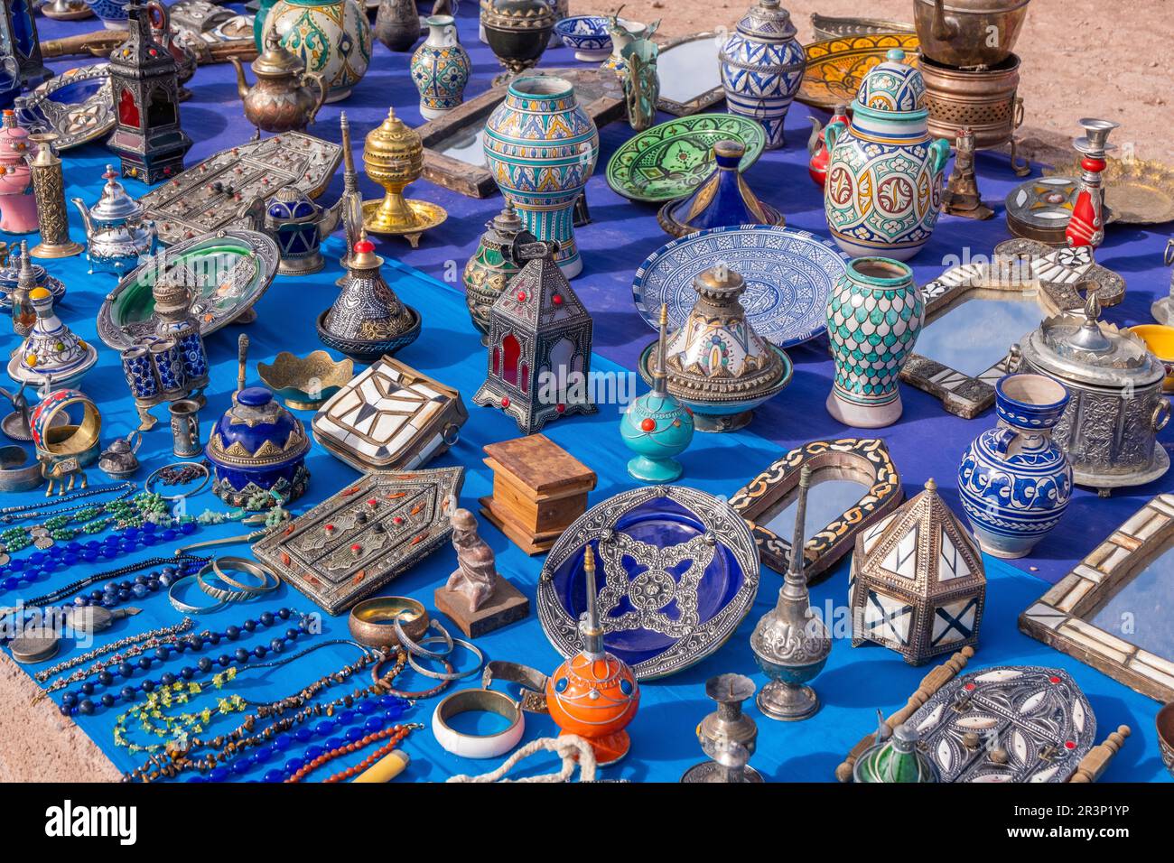 A colorful Moroccan market scene along a bustling street selling ...