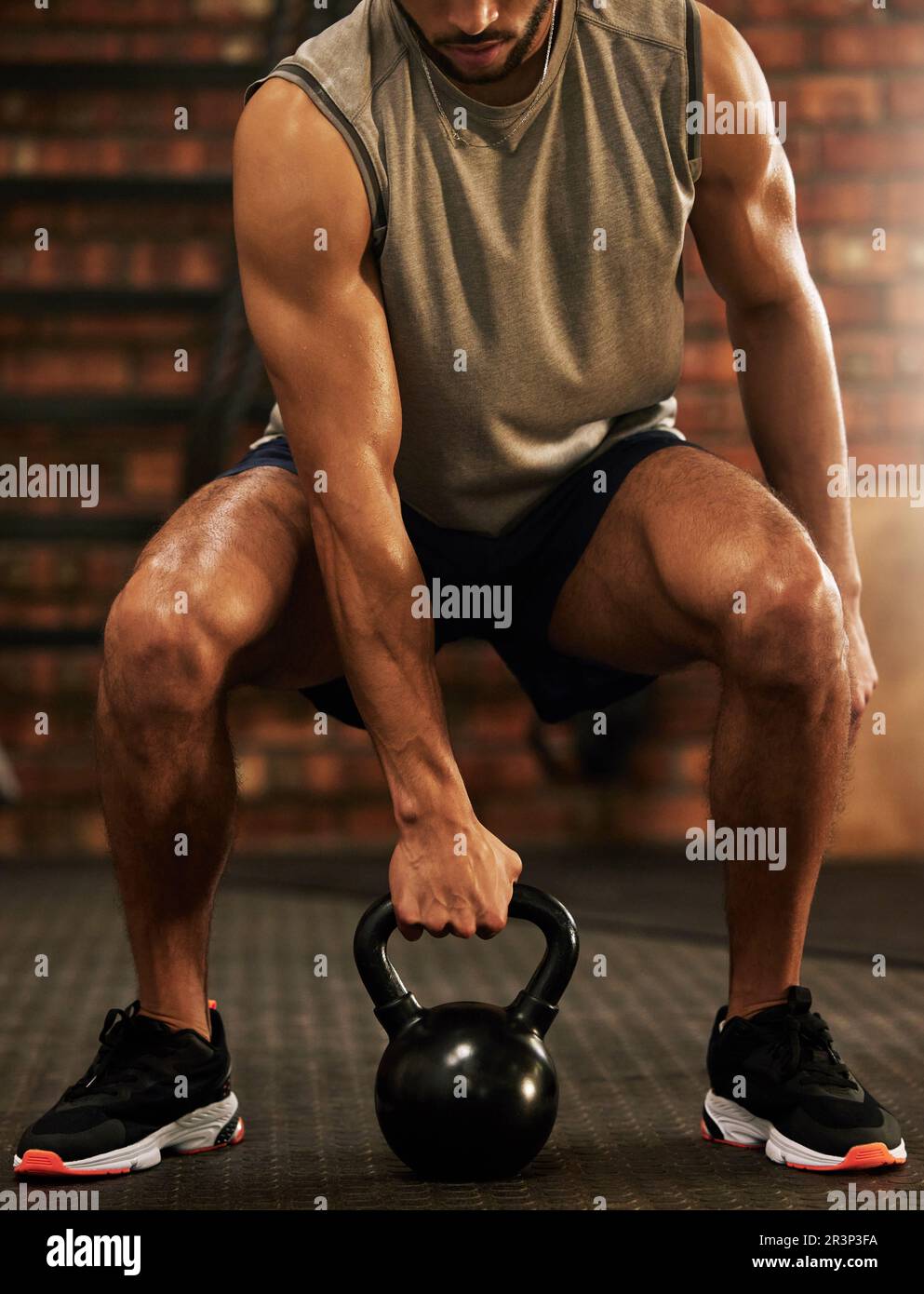 Fitness, kettlebell and man doing a squat workout in the gym for ...