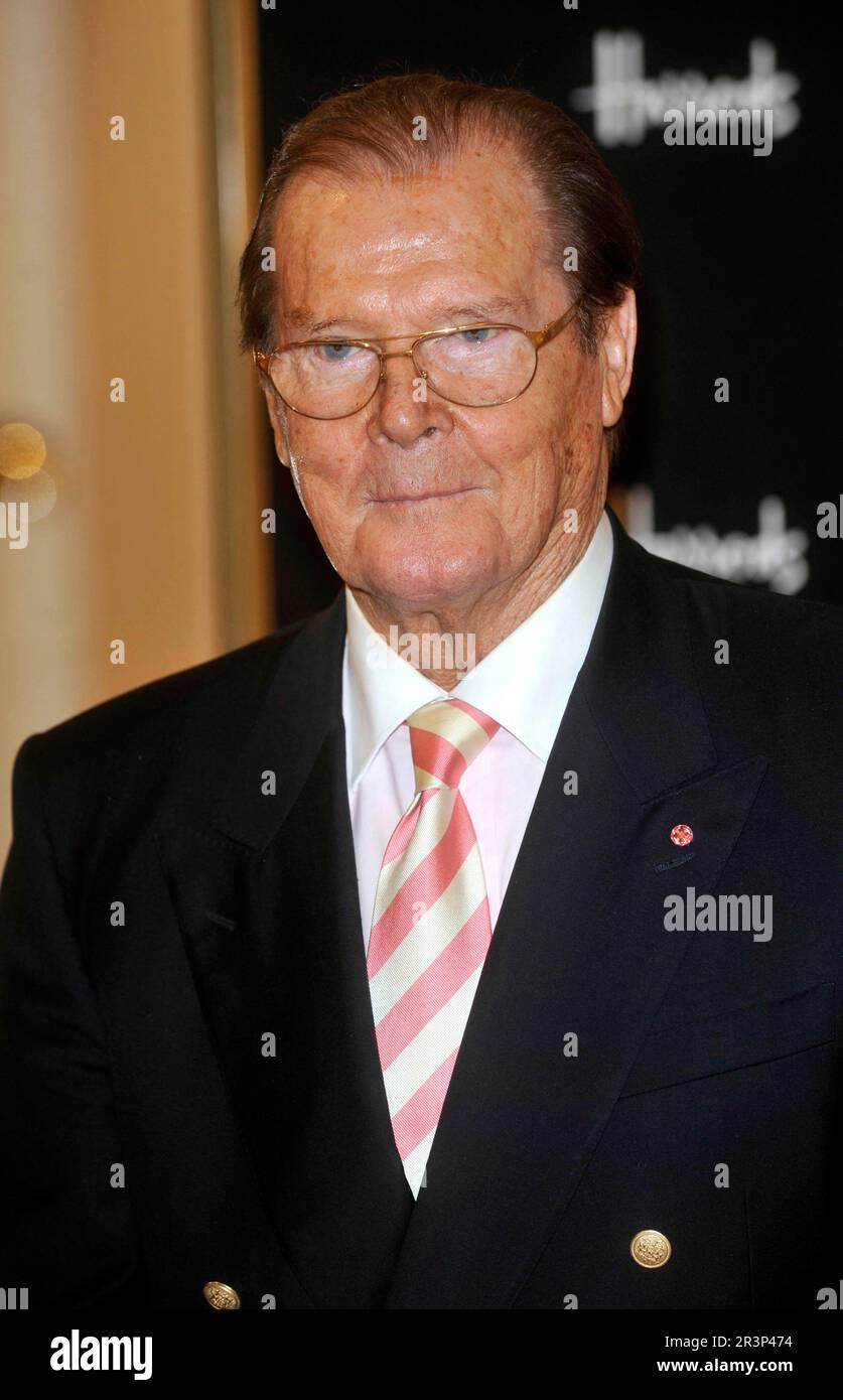 London. UK. Sir Roger Moore signing copies of his book 'Bond on Bond ...