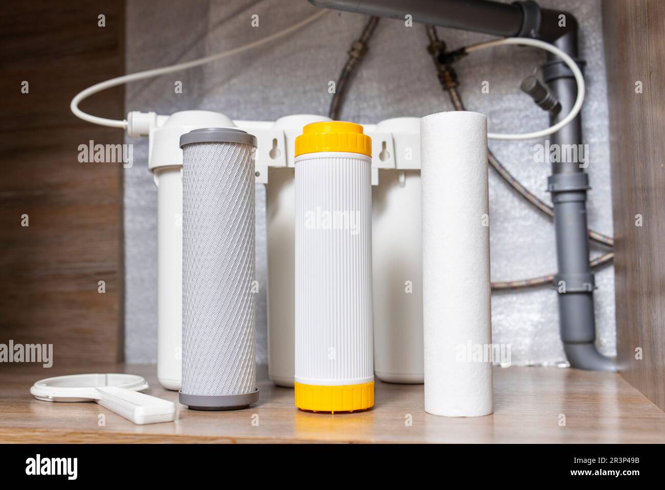 Installation or replacement of water purification filters under kitchen ...