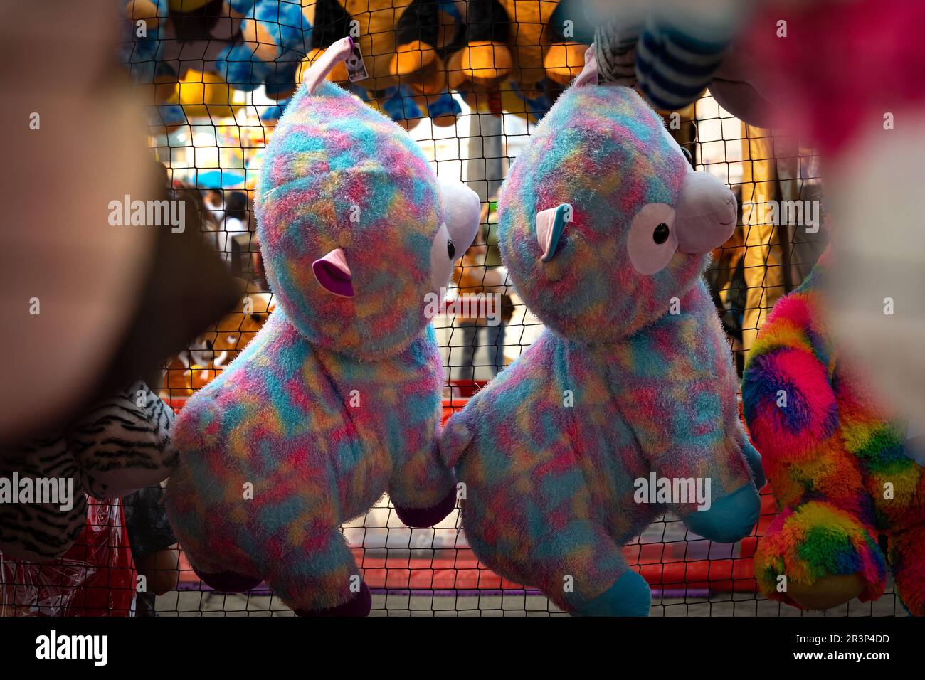 Colorful stuffed Animal prizes hanging in fair game booth Stock Photo ...