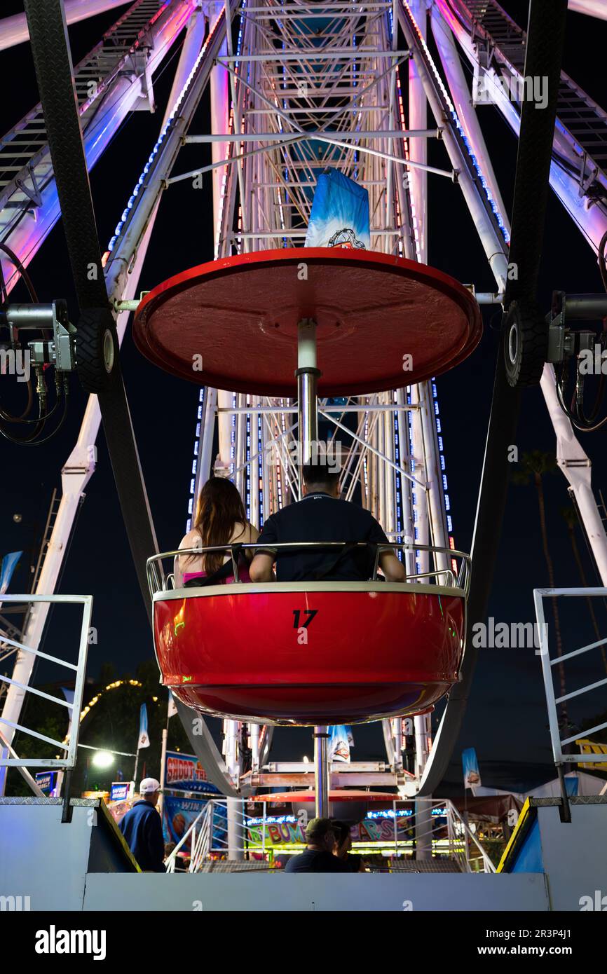 Couple in Ferris Wheel car at night portrait at the Los Angeles County ...