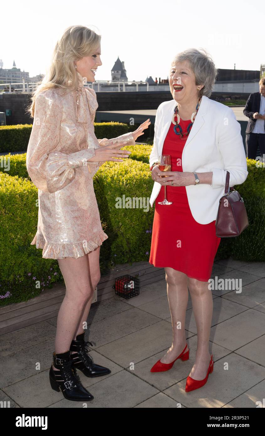 Cleo Watson (left) talking to former prime minister Theresa May at the ...