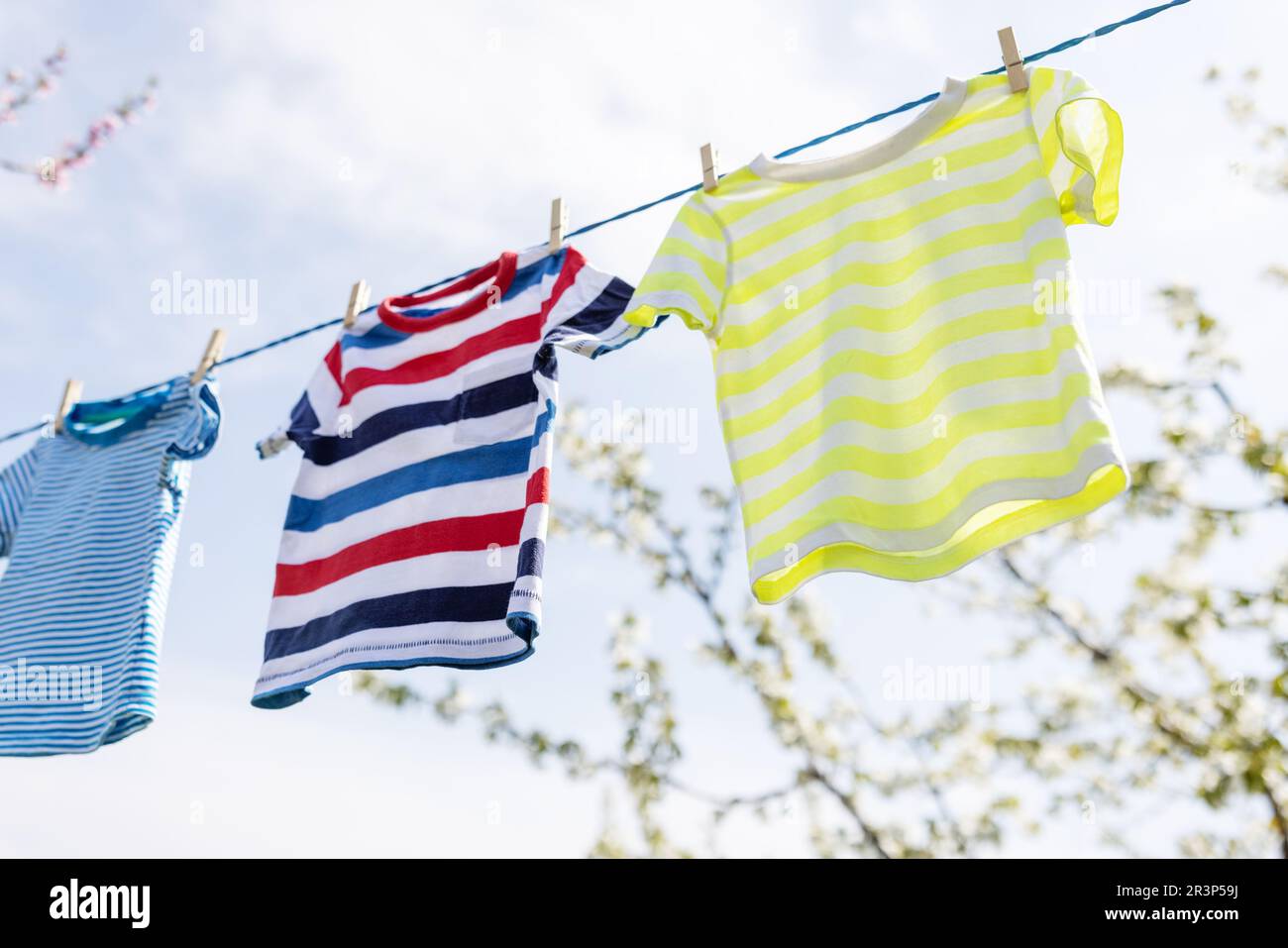 Clean clothes on rope outdoors on laundry day Stock Photo - Alamy