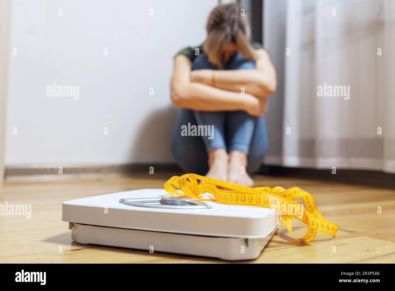 White scale and depression, upset and sad woman with measuring tape on ...