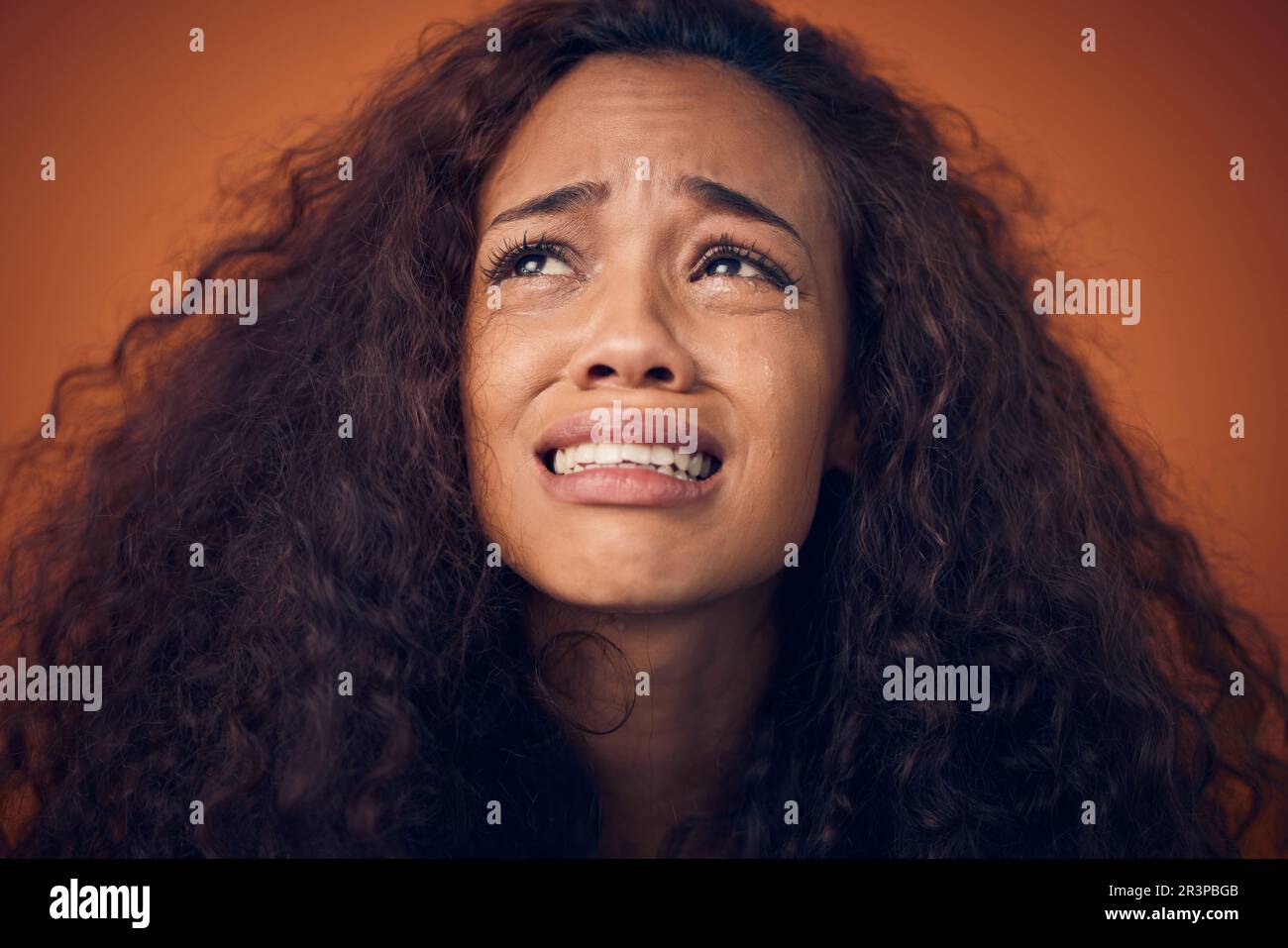 Woman, crying and sad face in studio with anxiety, mental health ...