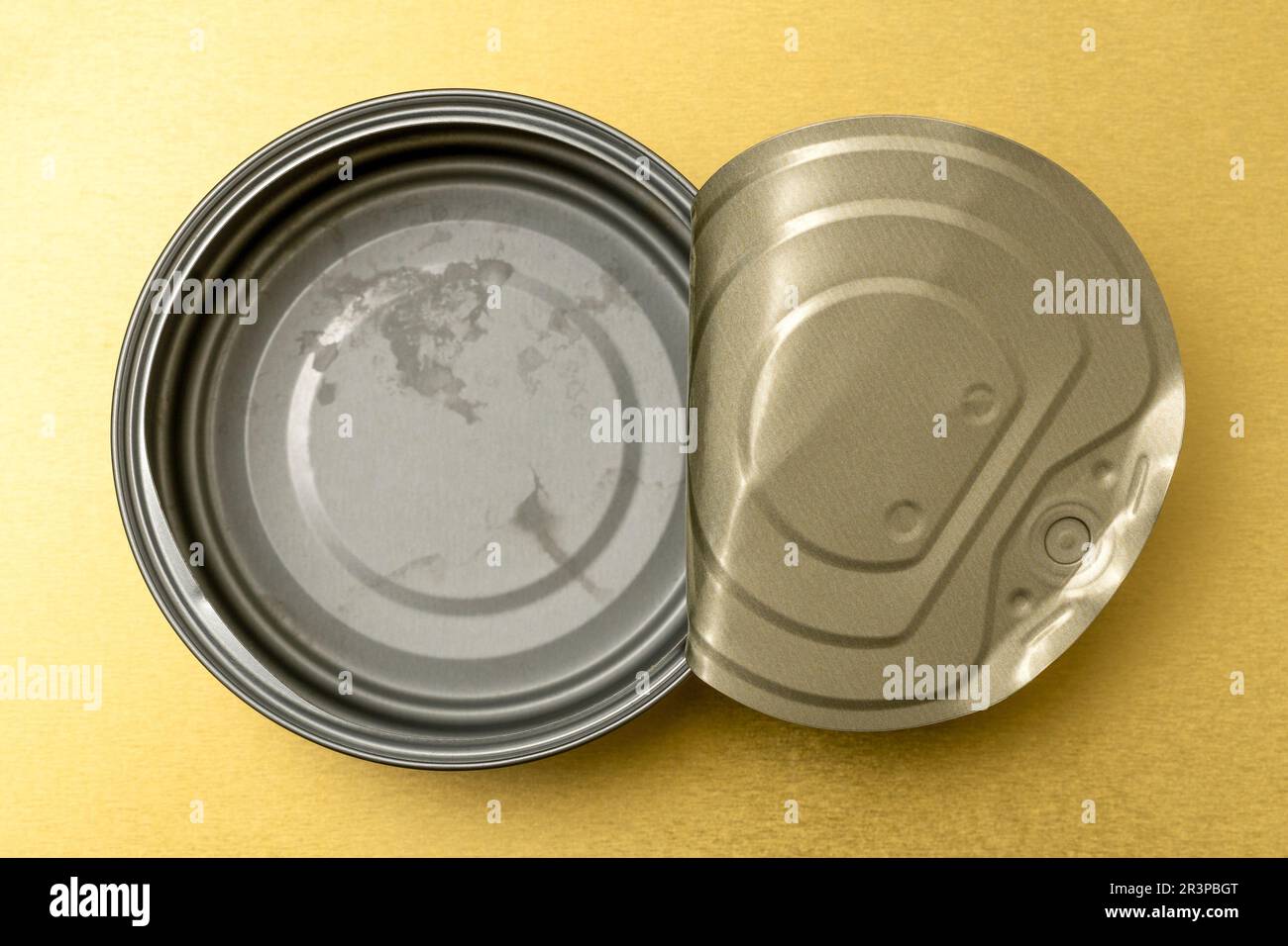Old tin can for food on golden metal background Stock Photo - Alamy