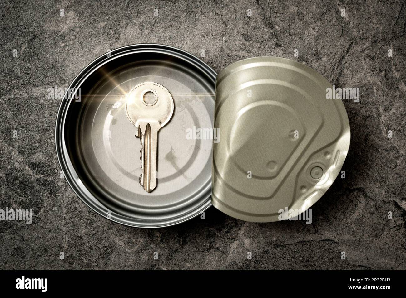 Opened tin can with a shiny key inside Stock Photo - Alamy