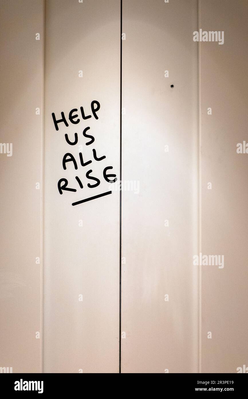 help us all rise sign in elevator in Brooklyn NYC Stock Photo - Alamy