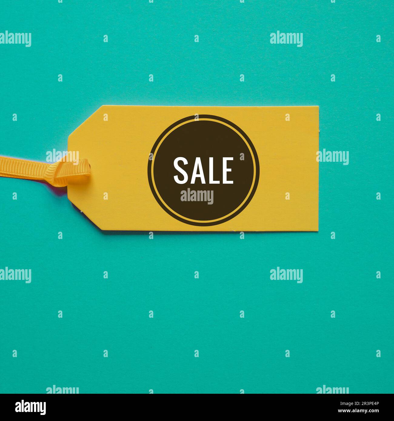 sale word on the yellow price tag for sales Stock Photo - Alamy