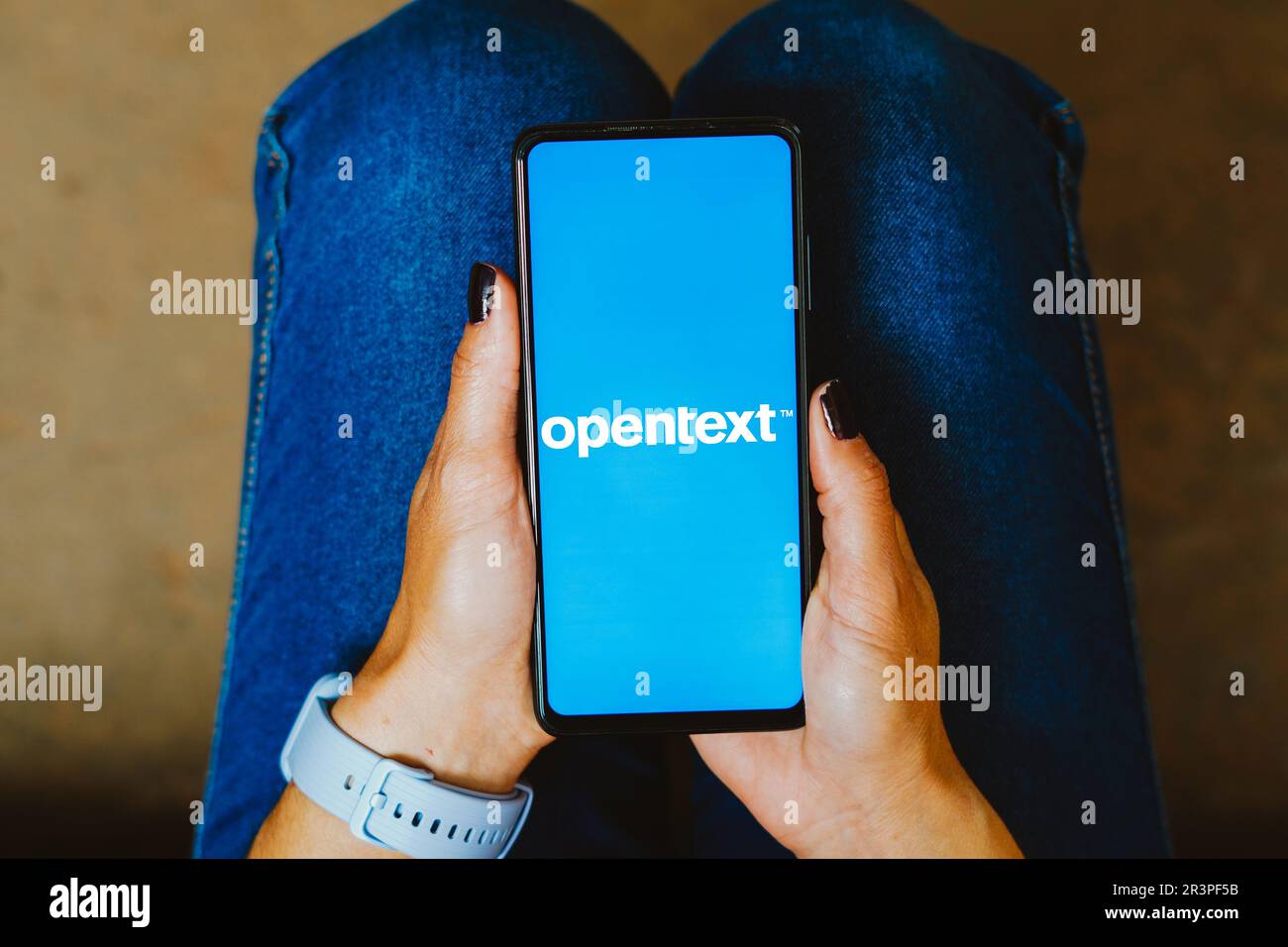 In this photo illustration, the OpenText Corporation logo is displayed ...