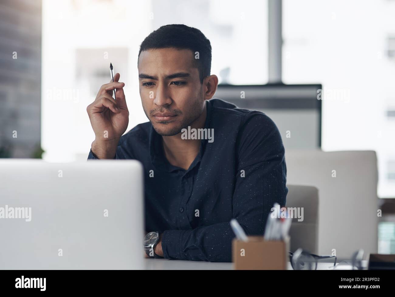 Laptop, thinking and reading with a man journalist working in his ...