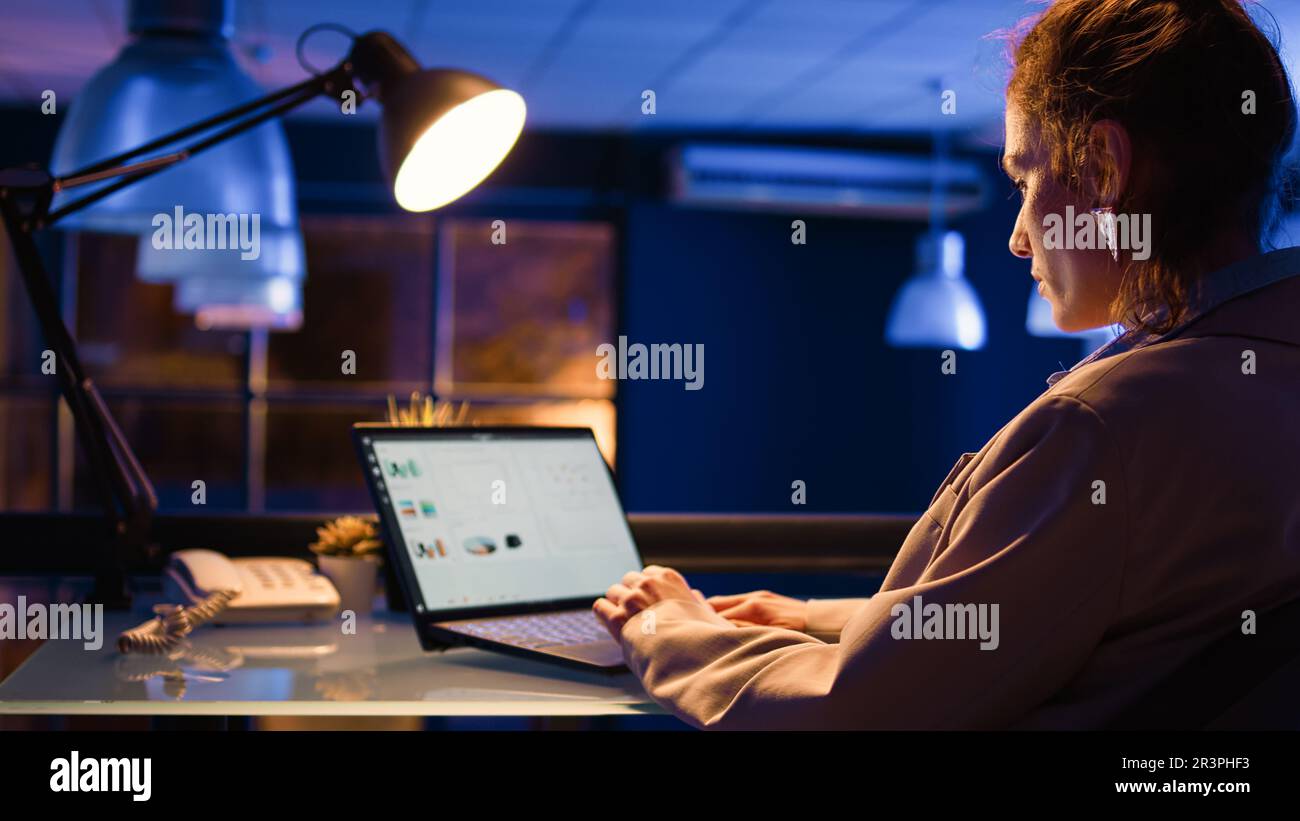 Office employee working with financial graphs report Stock Photo - Alamy
