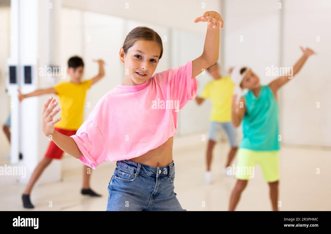 Group of kids training modern dance moves Stock Photo - Alamy