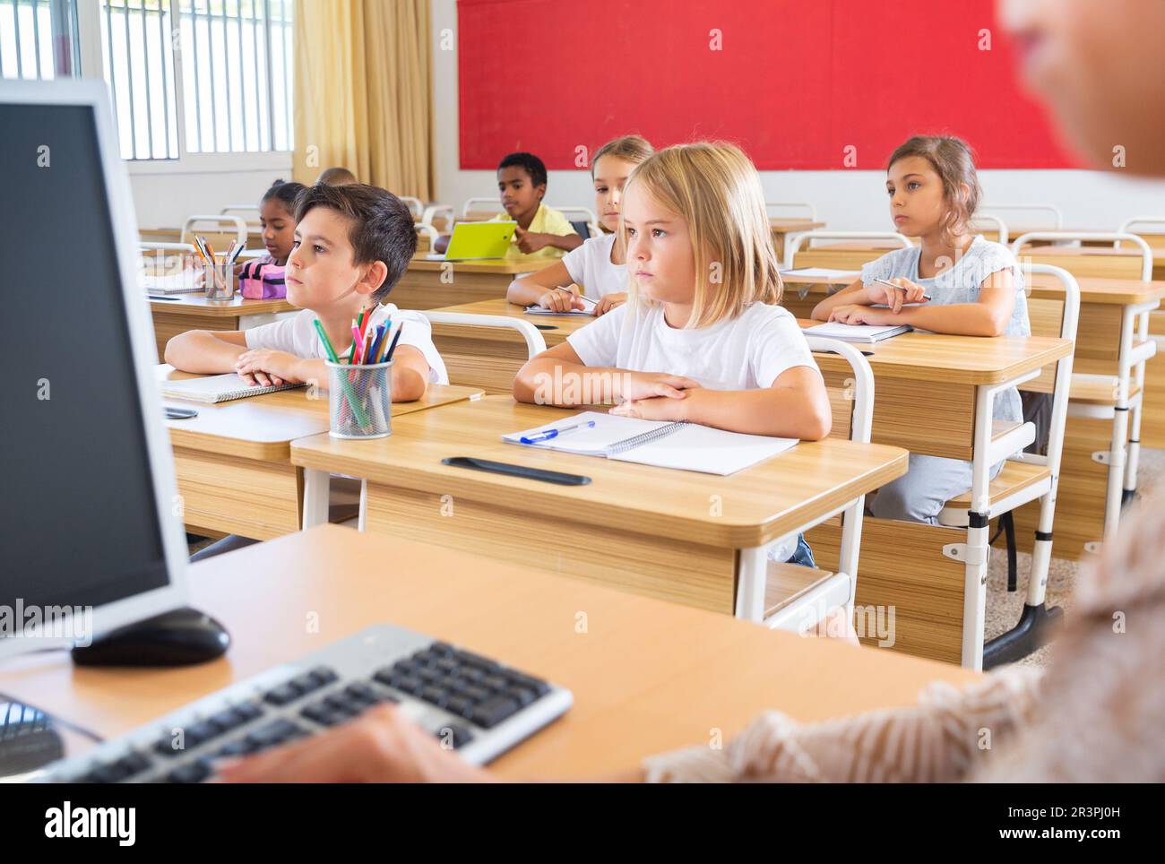 Group of focused children working at class Stock Photo - Alamy