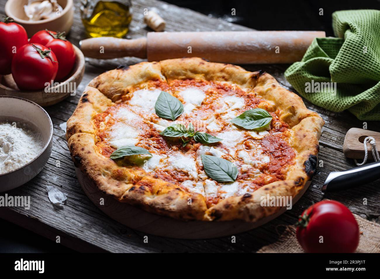 Italian Pizza Napoletana in Messy Kitchen with Cooking Ingredients such ...