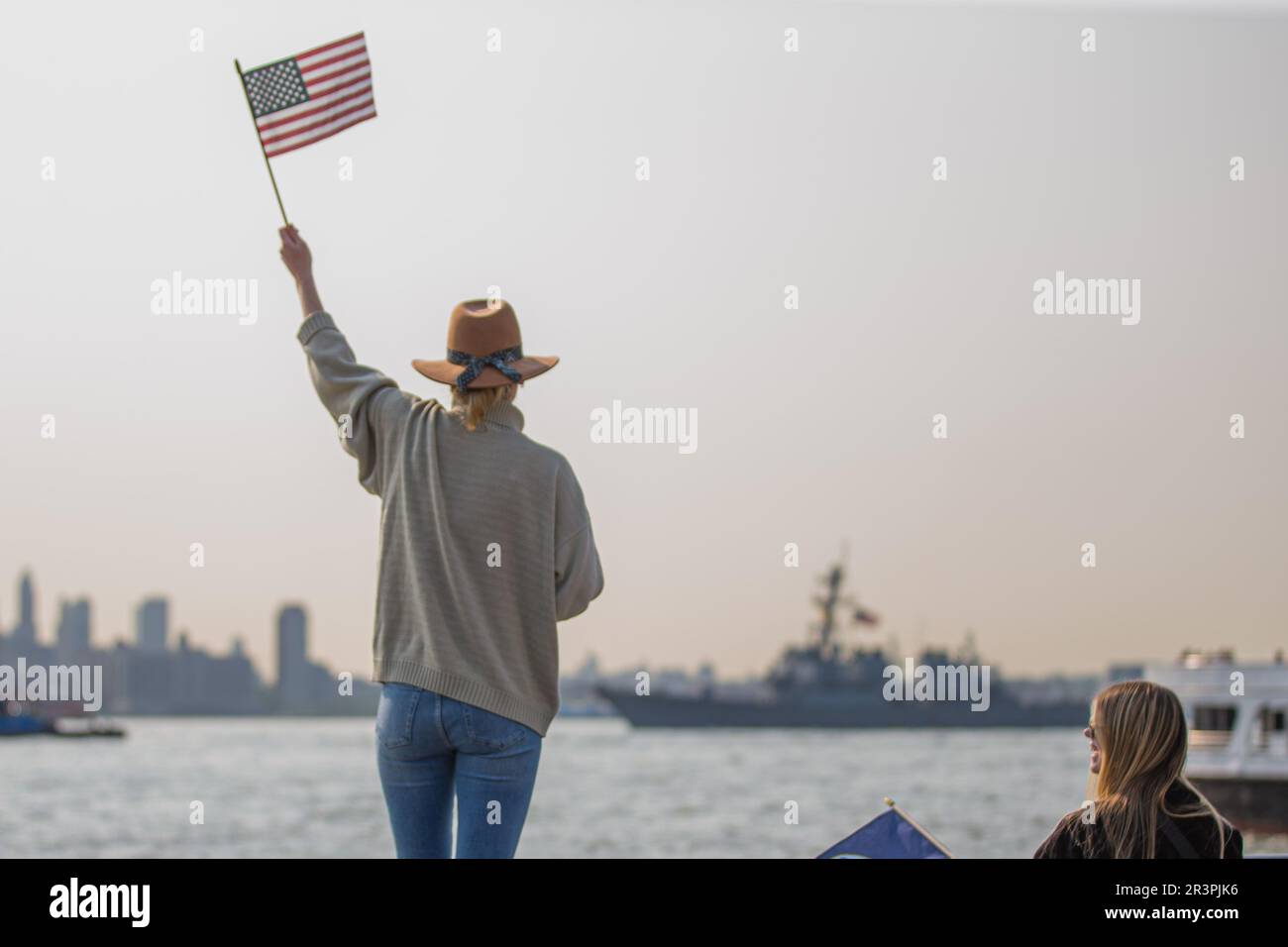 New York, New York, USA. 24th May, 2023. A woman waves an American Flag ...