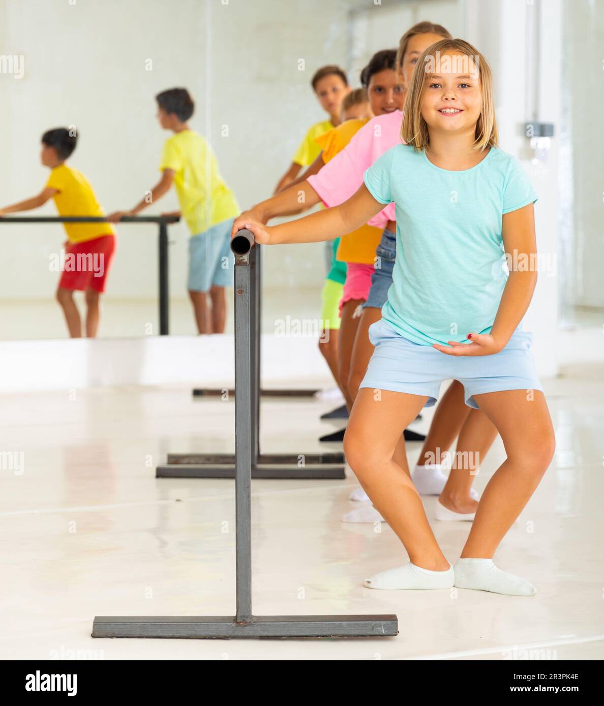 Group of smiling children practicing at ballet barre Stock Photo - Alamy