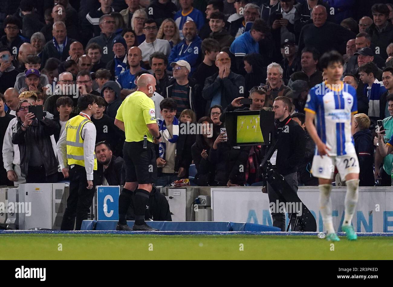 Referee Simon Hooper watches the pitch side VAR monitor before ruling a ...