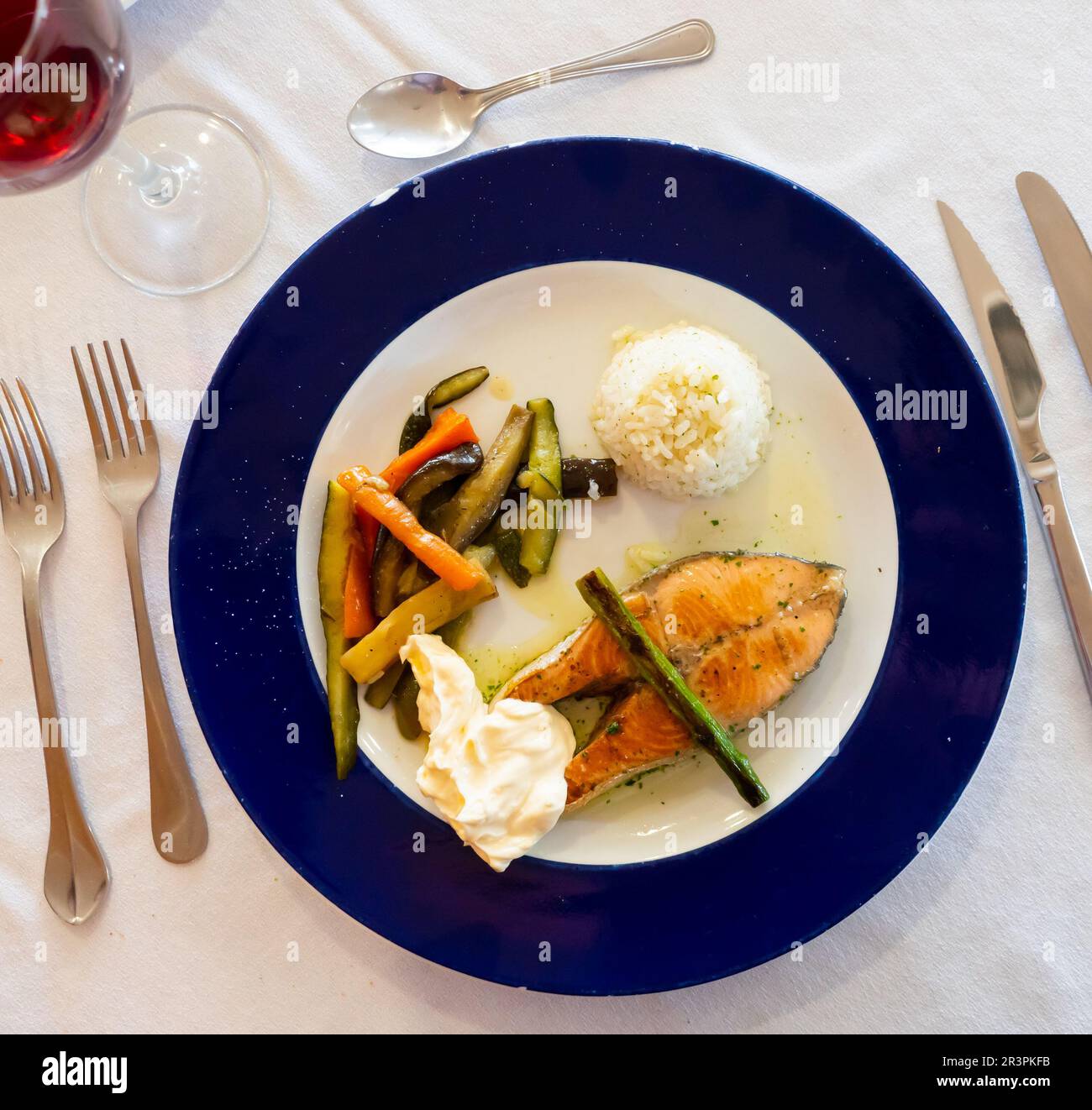 Baked salmon served with rice and vegetables Stock Photo - Alamy