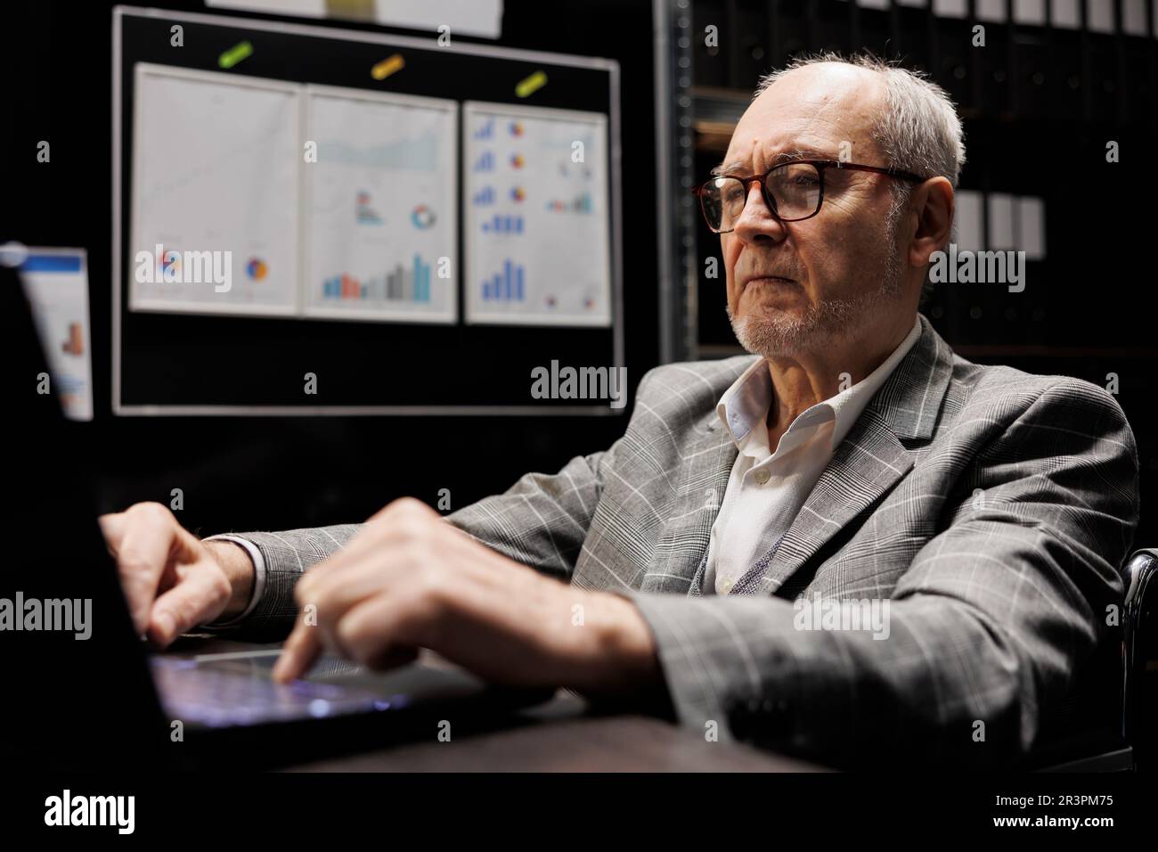 Accountant checking statistics in office Stock Photo - Alamy