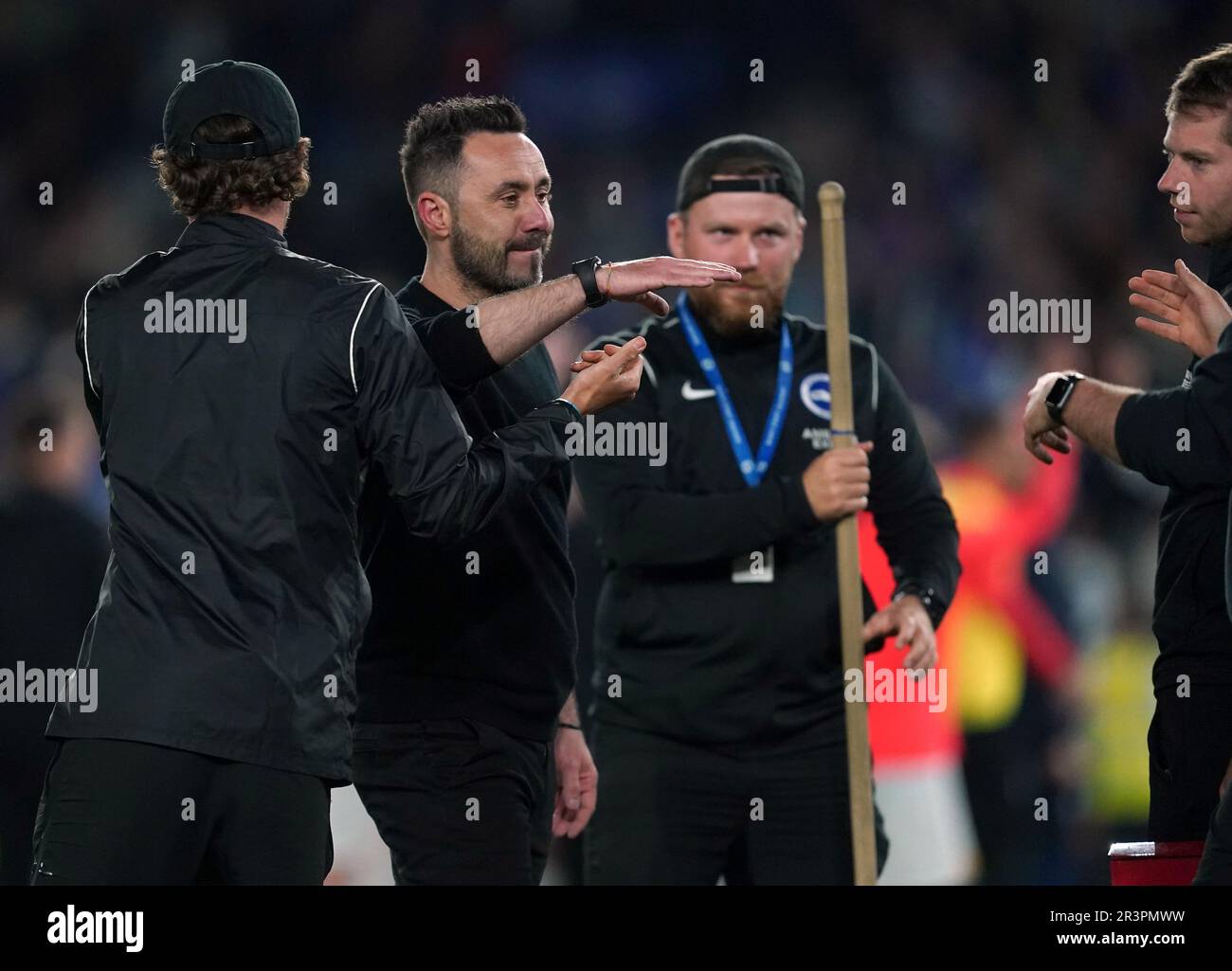 Brighton and Hove Albion manager Roberto De Zerbi with ground staff ...