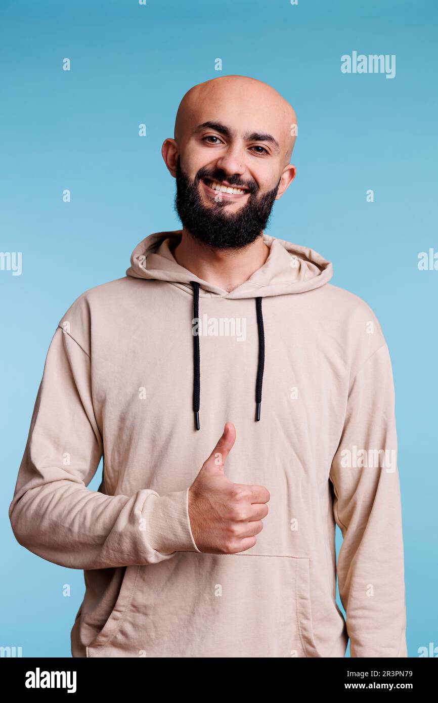 Arab man showing thumb up gesture Stock Photo - Alamy