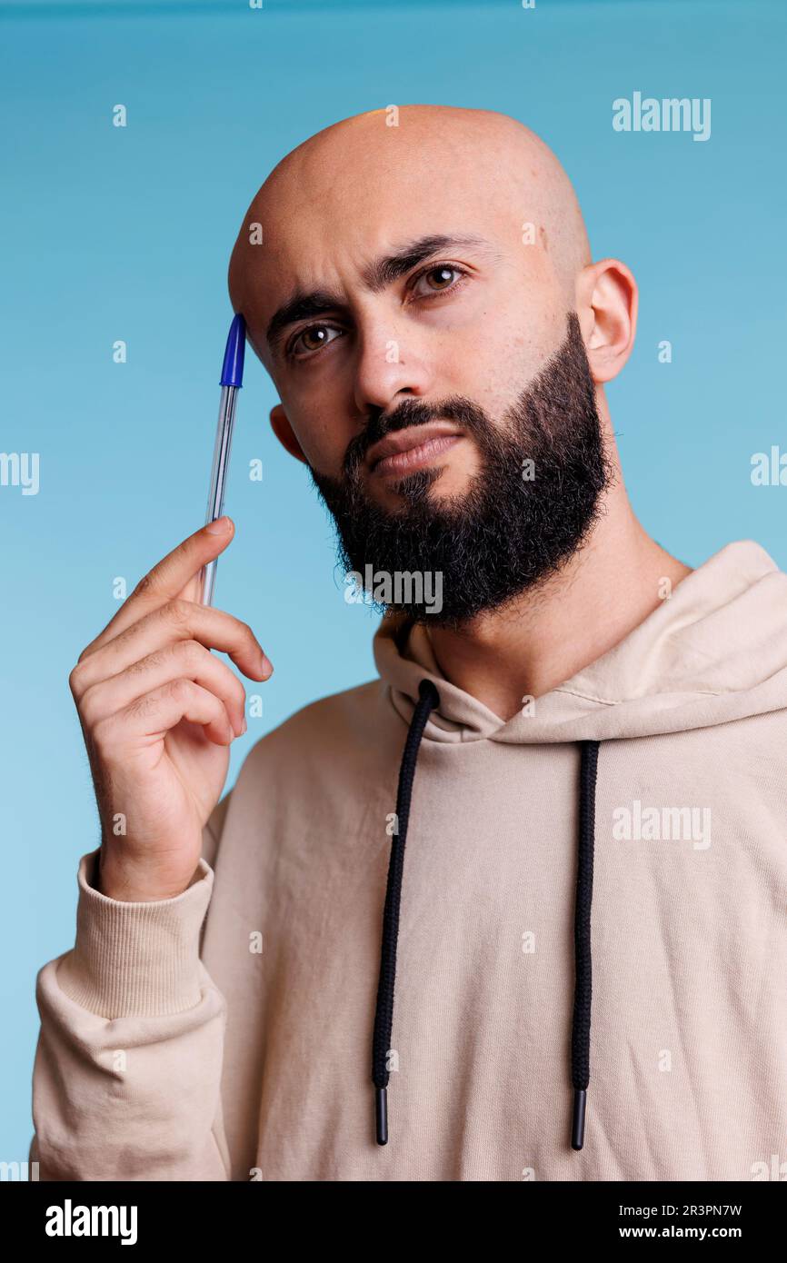 Arab man holding pen hi-res stock photography and images - Alamy