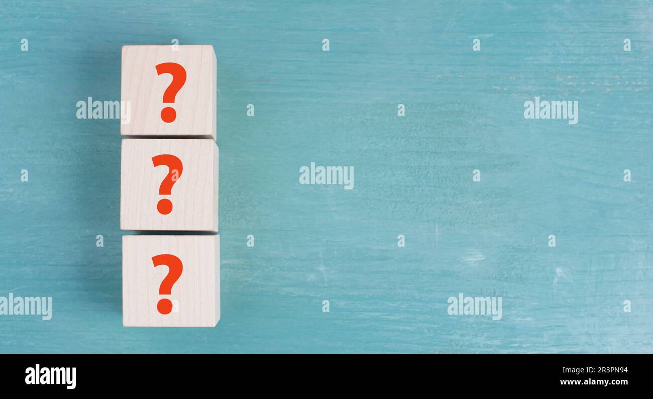 Question marks on wooden cubes, question and answer, meeting and ...