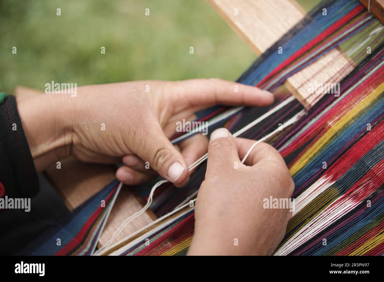 Close shot of female weaver using a loom in Pongobamba, Peru Stock ...