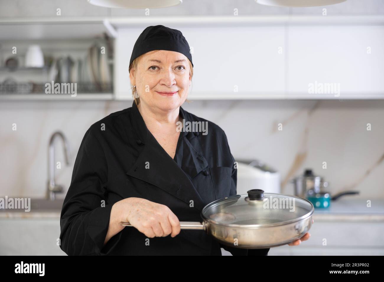 Old female cook uniform hi-res stock photography and images - Alamy