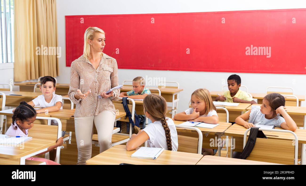 Teacher tells an interesting lecture in free communication with ...