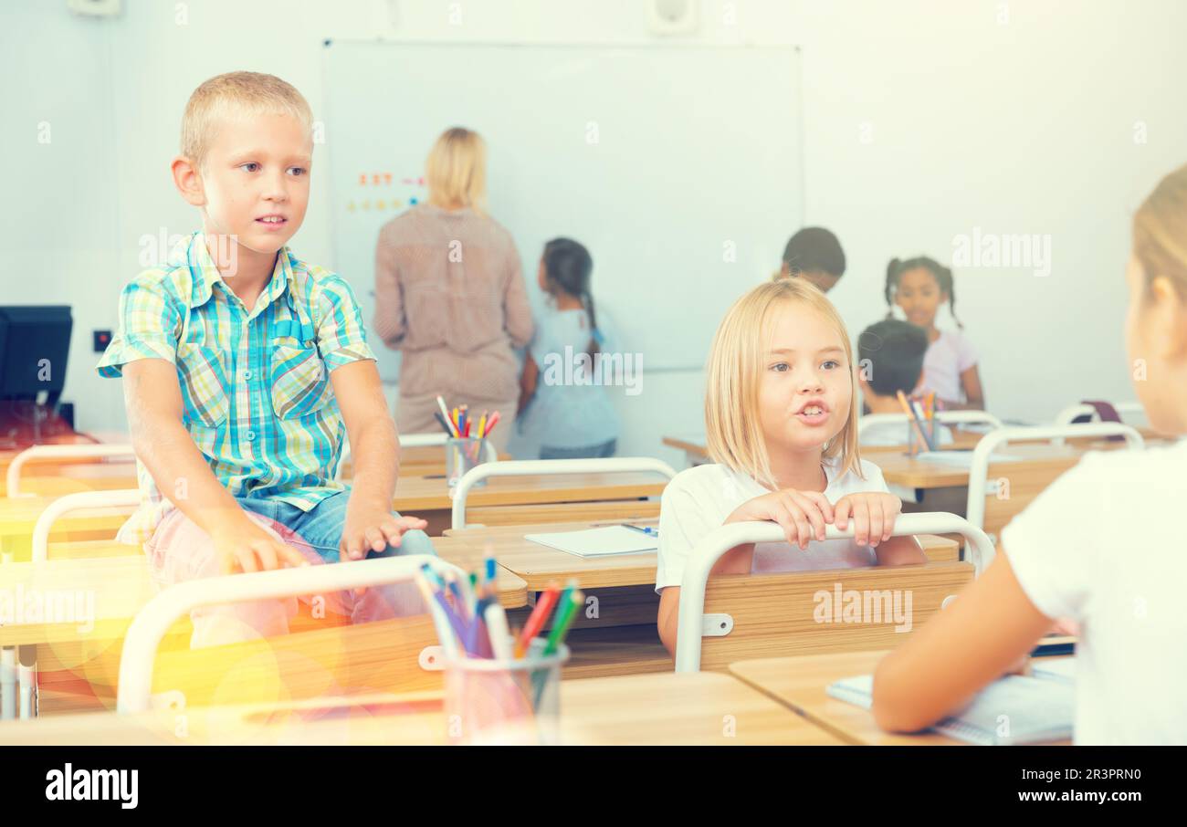 Kids pupils talking during recess between lessons Stock Photo - Alamy