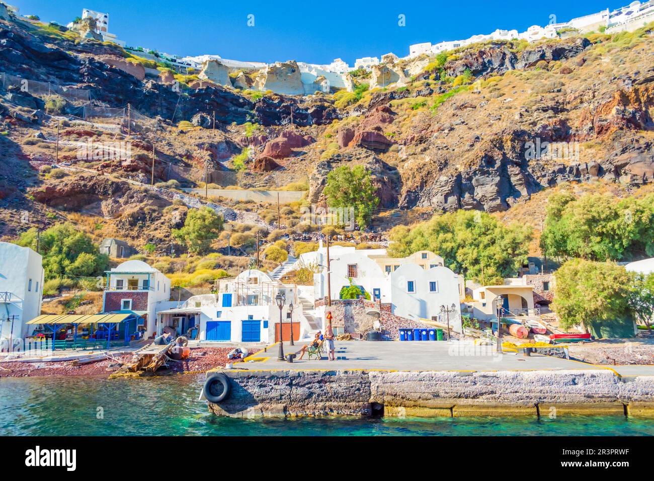 Oia village perched atop seen from the Caldera,Santorini.amazing ...