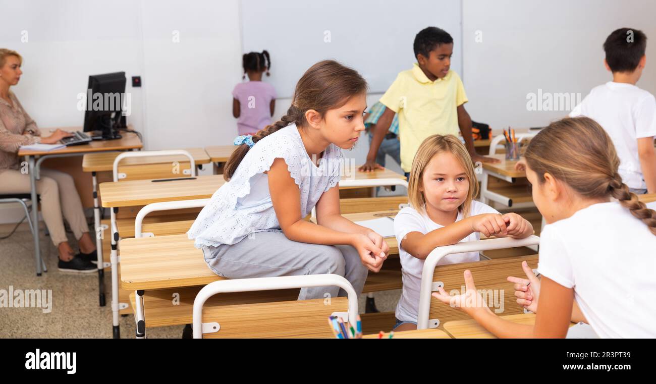 Kids pupils talking during recess between lessons Stock Photo - Alamy